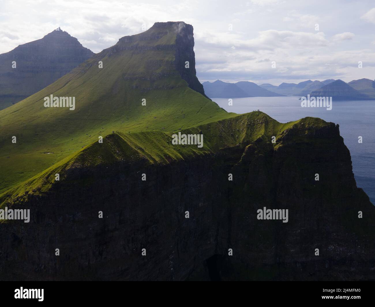 Beautiful aerial view of the Kallur Lighthouse in the Faroe Islands ...