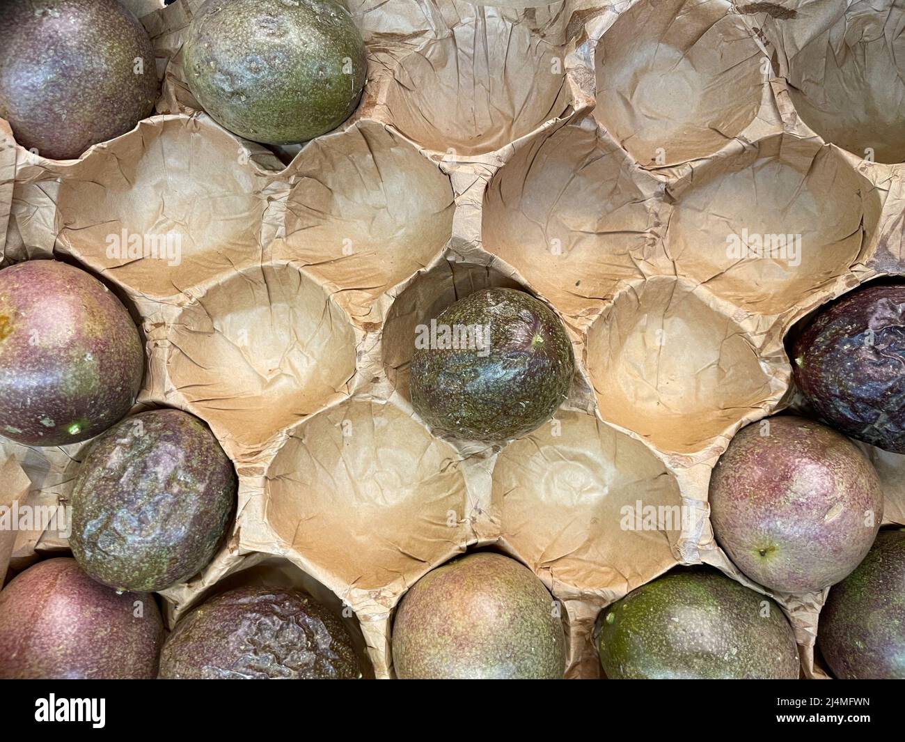 Delicious passion fruit on display in a retail store Stock Photo - Alamy