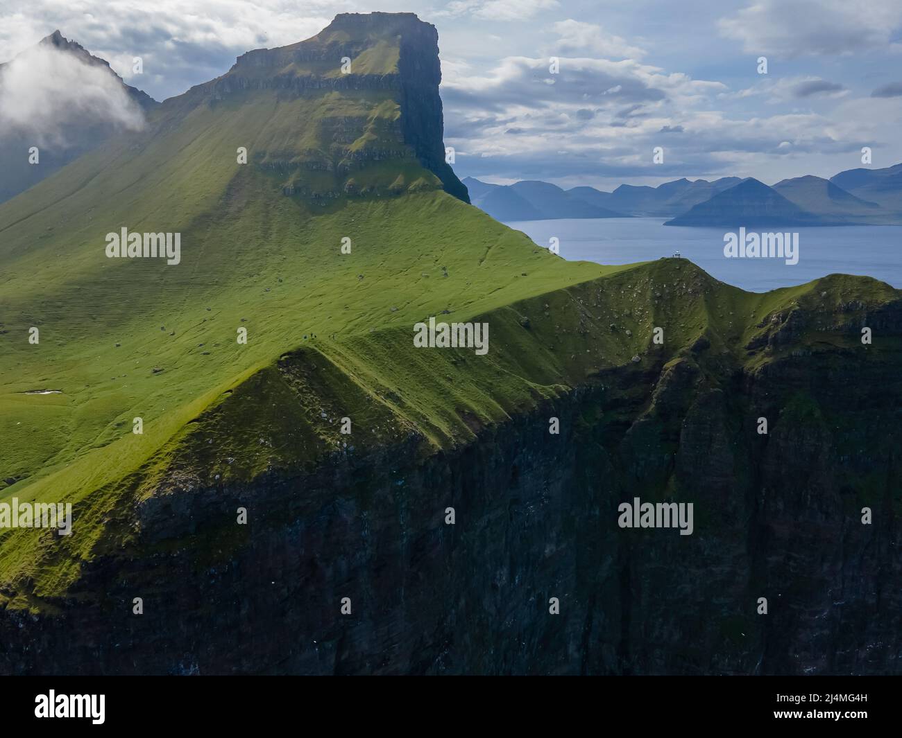 Beautiful aerial view of the Kallur Lighthouse in the Faroe Islands ...