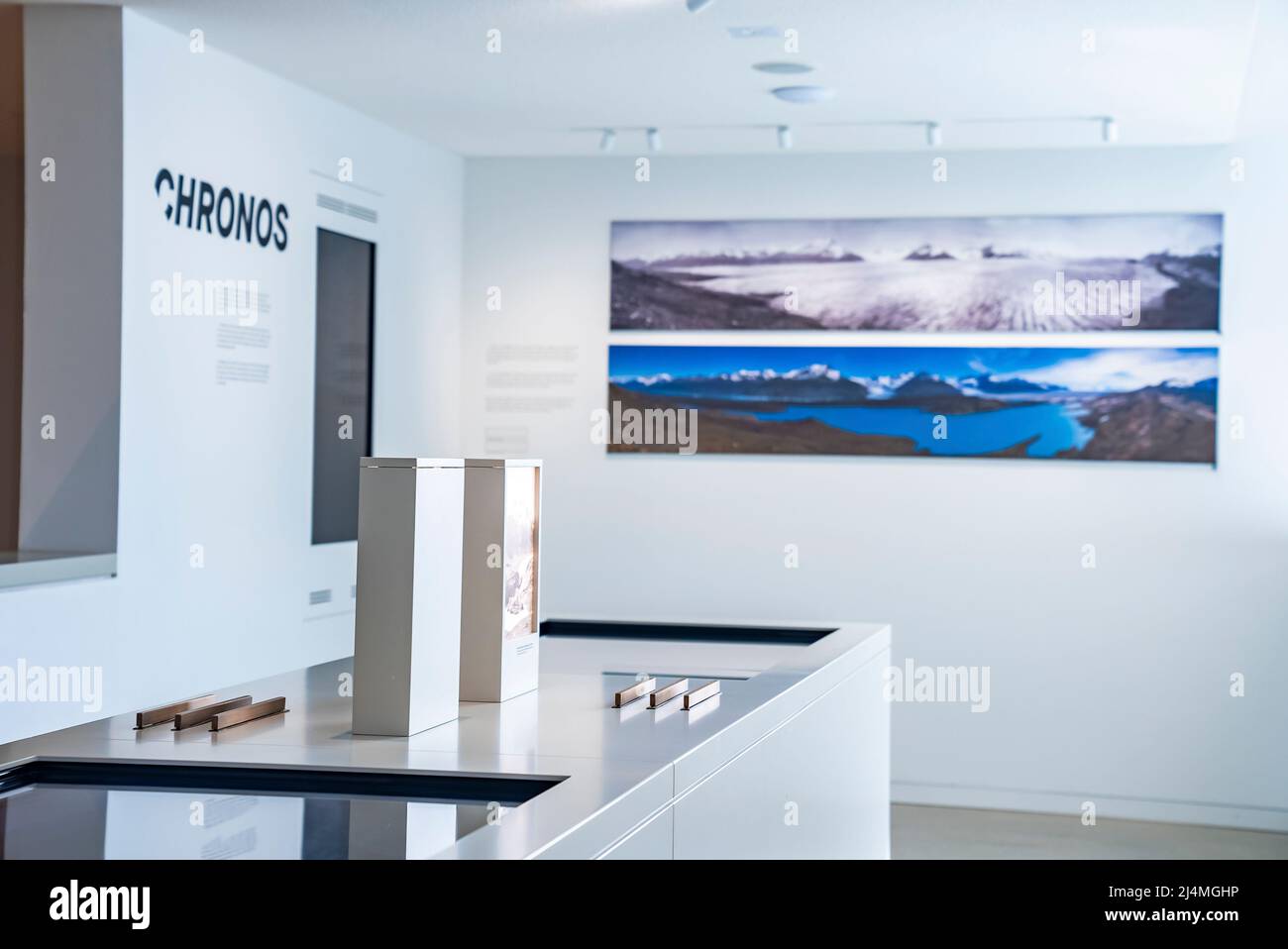 Interior of modern museum decorated with wooden structure and paintings ...