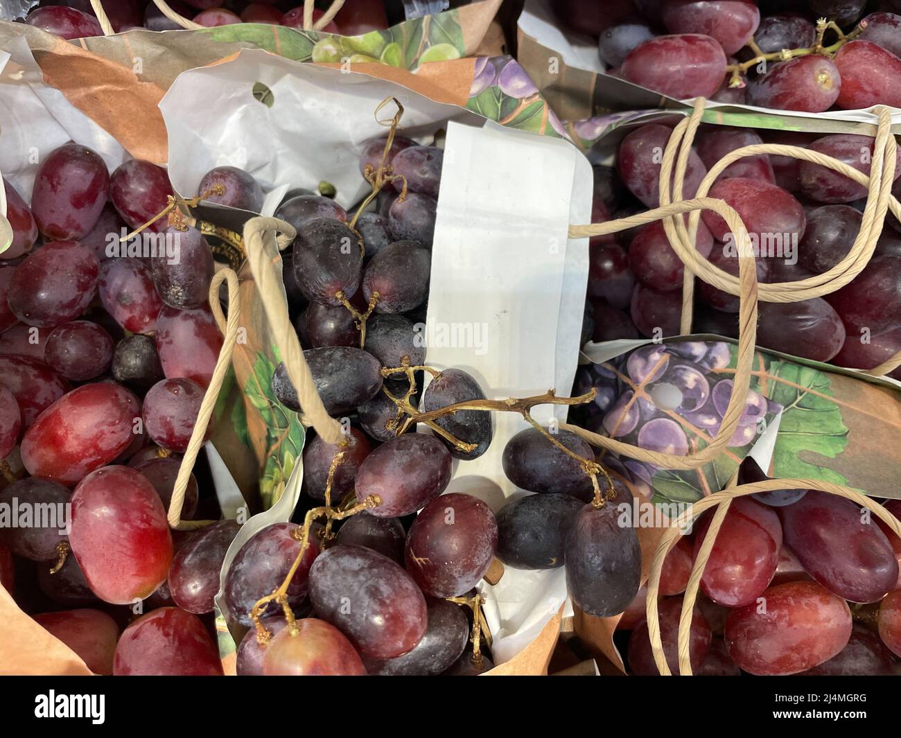 Delicious grapes on display in a retail store Stock Photo - Alamy