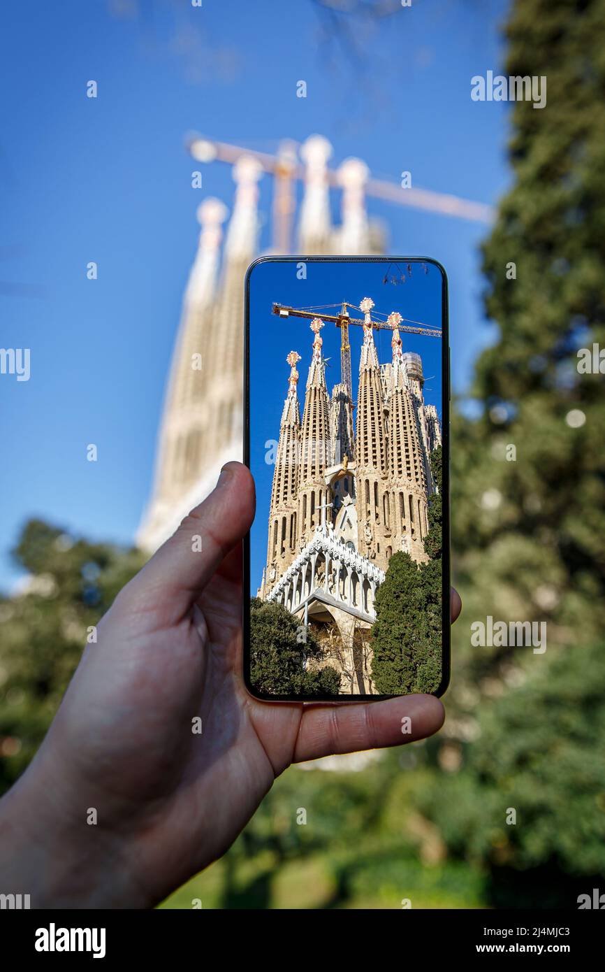 Taking a photo of Sagrada Familia with a mobile phone camera in ...