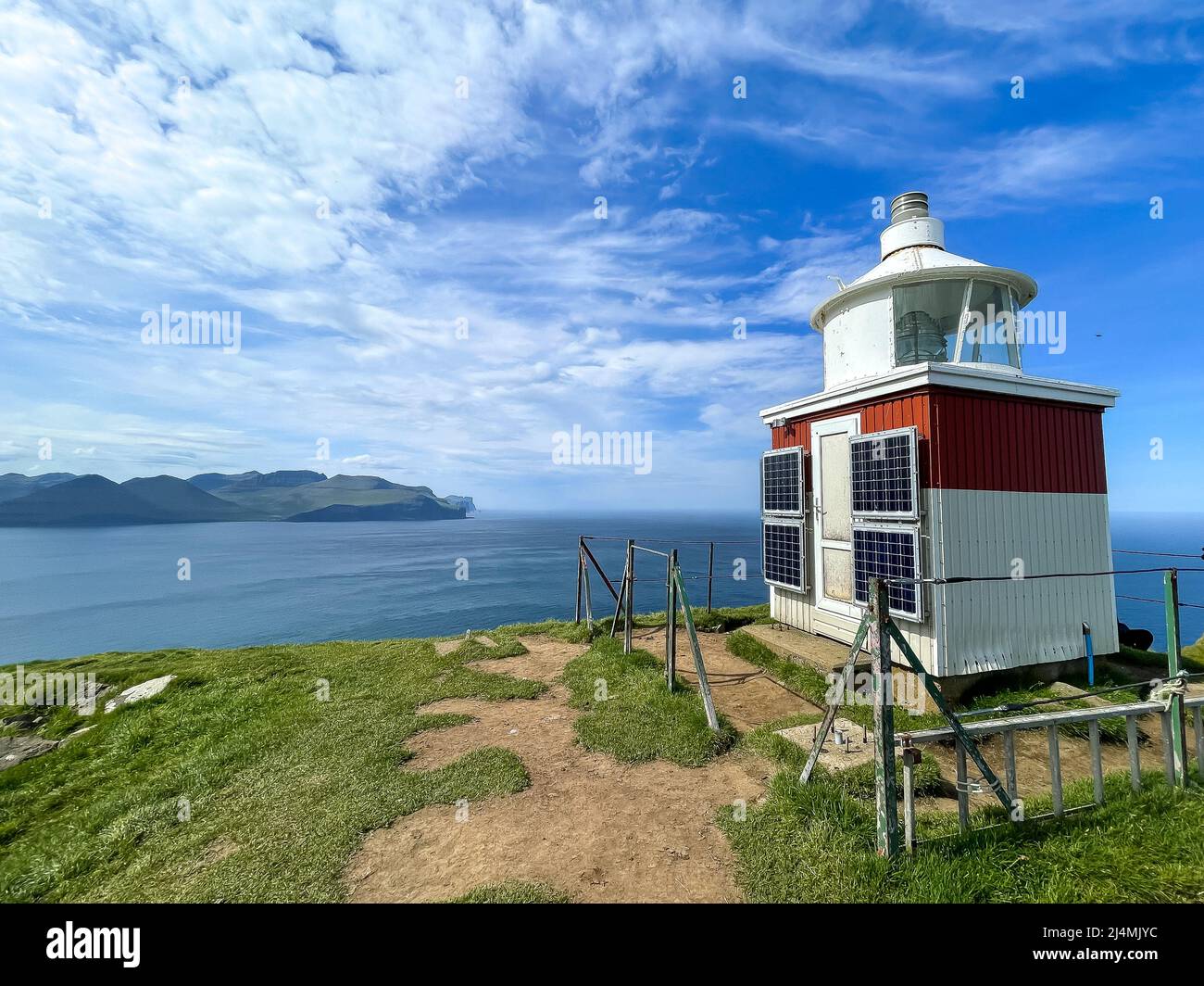 Beautiful aerial view of the Kallur Lighthouse in the Faroe Islands ...
