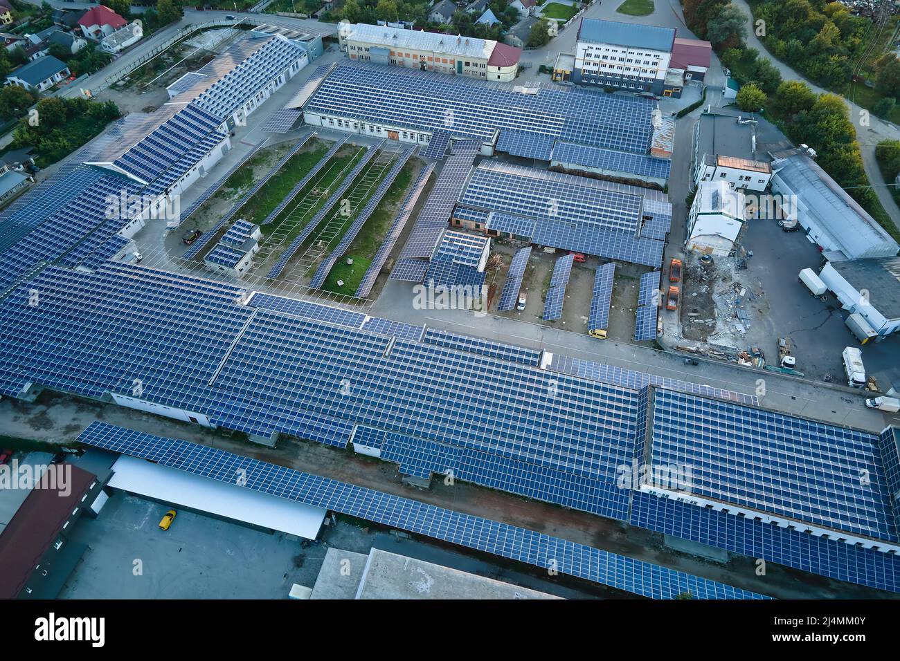 Aerial view of solar power plant with blue photovoltaic panels mounted ...