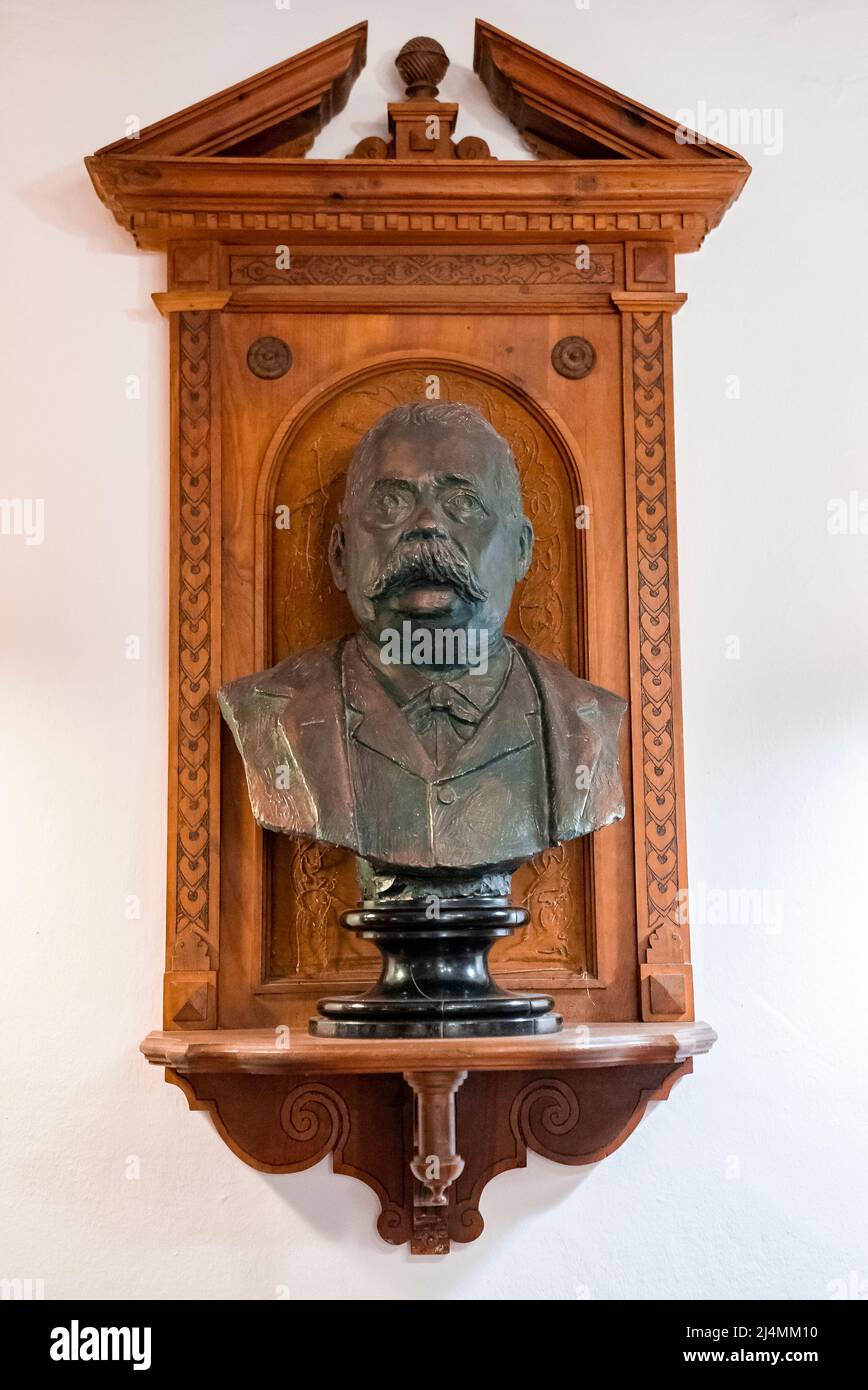 Antique monument bust with wooden frame mounted on stone wall Stock ...