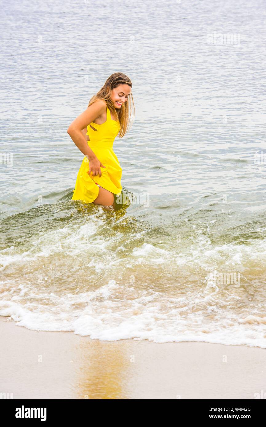 Woman wading in water in a dress hi-res stock photography and images ...