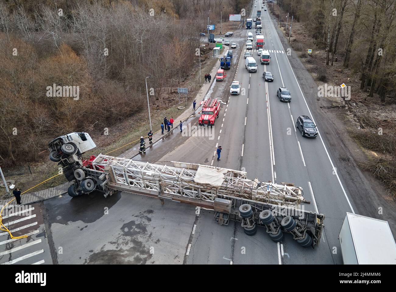 Aerial view of road accident with overturned truck blocking traffic ...