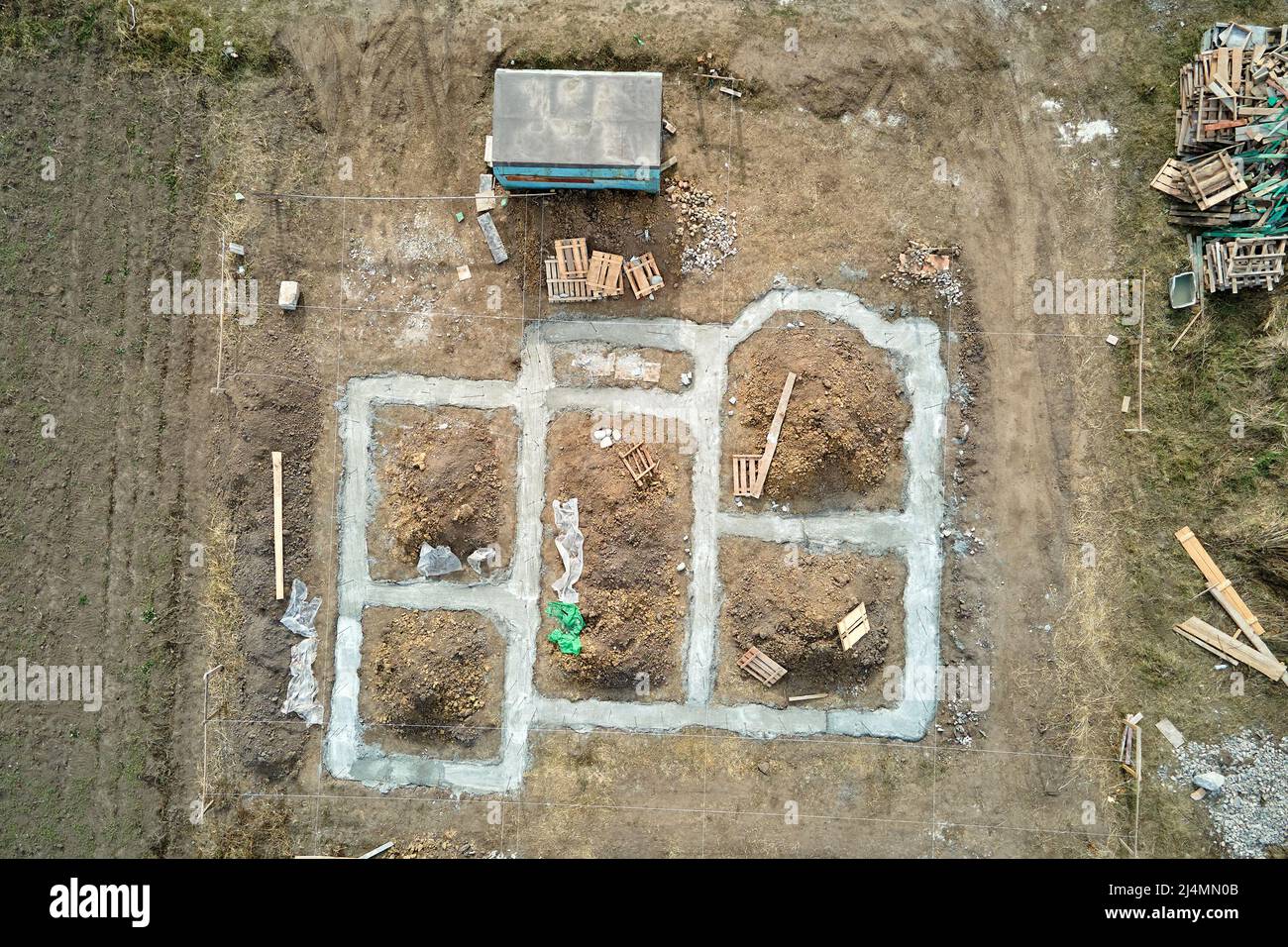 Top down aerial view of building works of new house concrete foundation ...