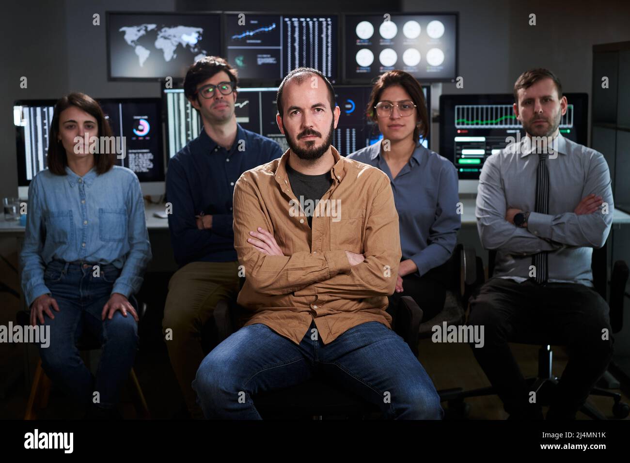 Business team serious faces hi-res stock photography and images - Alamy