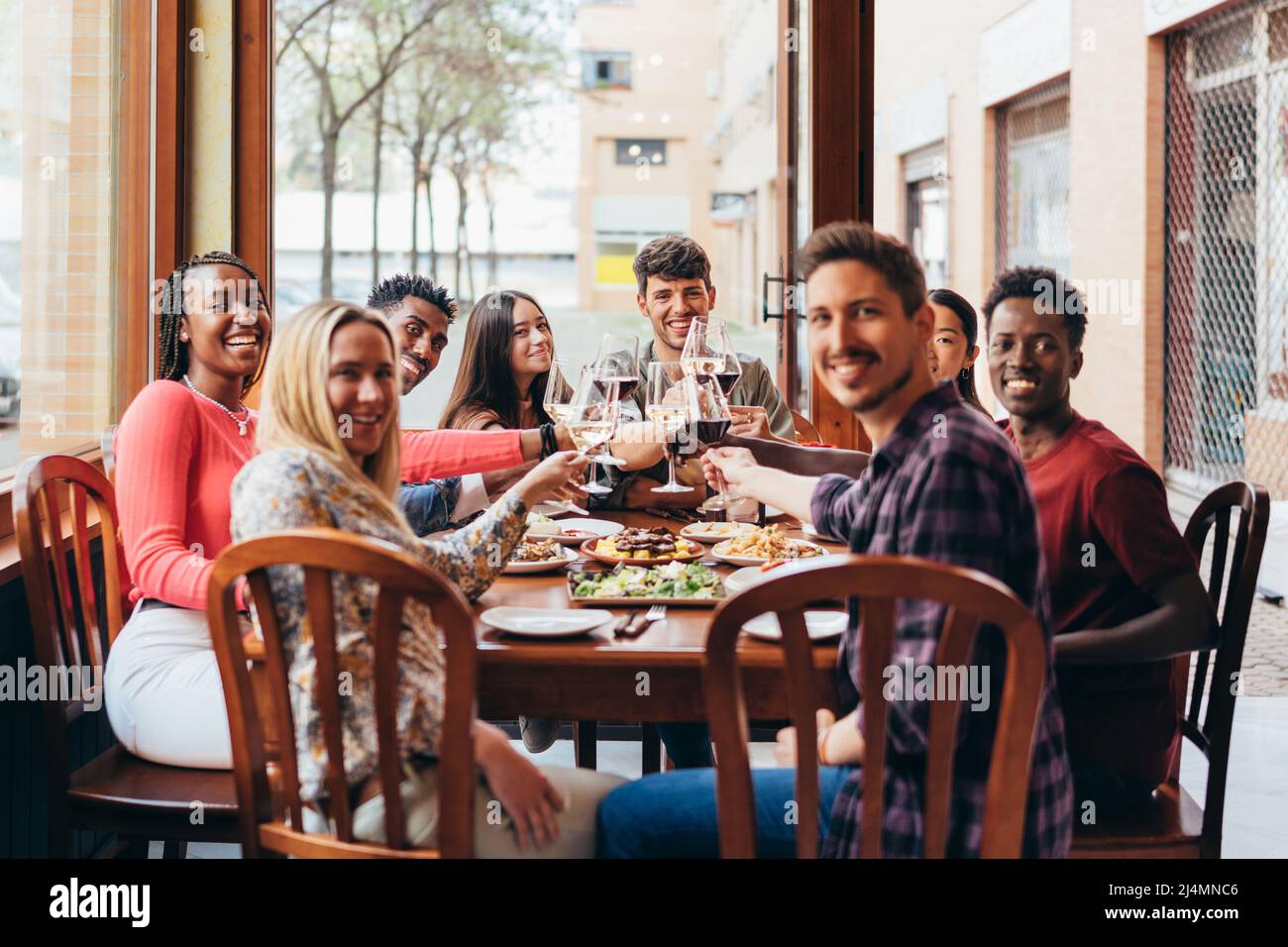 group of friends celebrating a meal in a restaurant Stock Photo - Alamy
