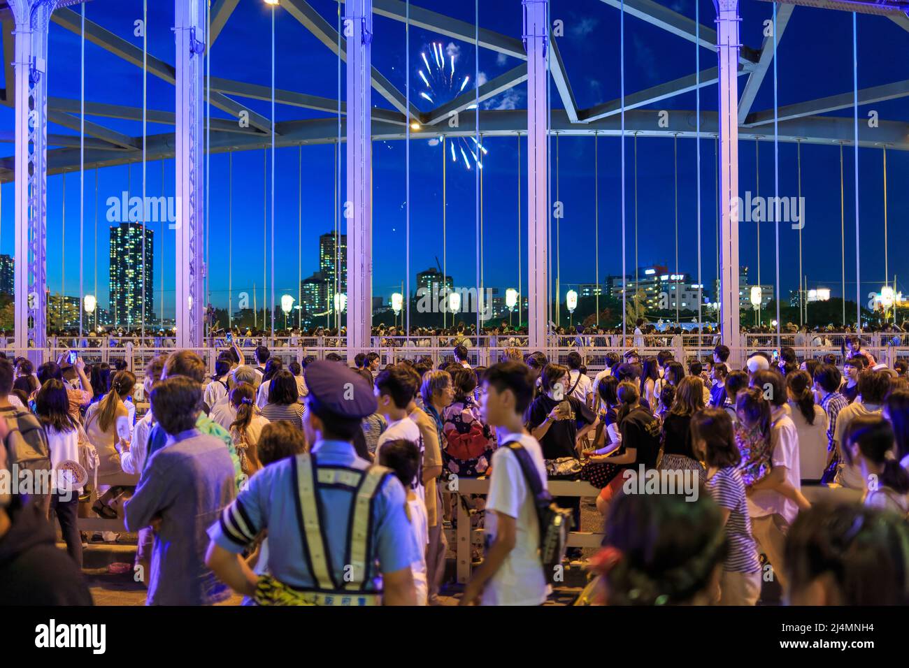 Osaka, Japan - July 25, 2015: Police officer overlooking crowd of ...