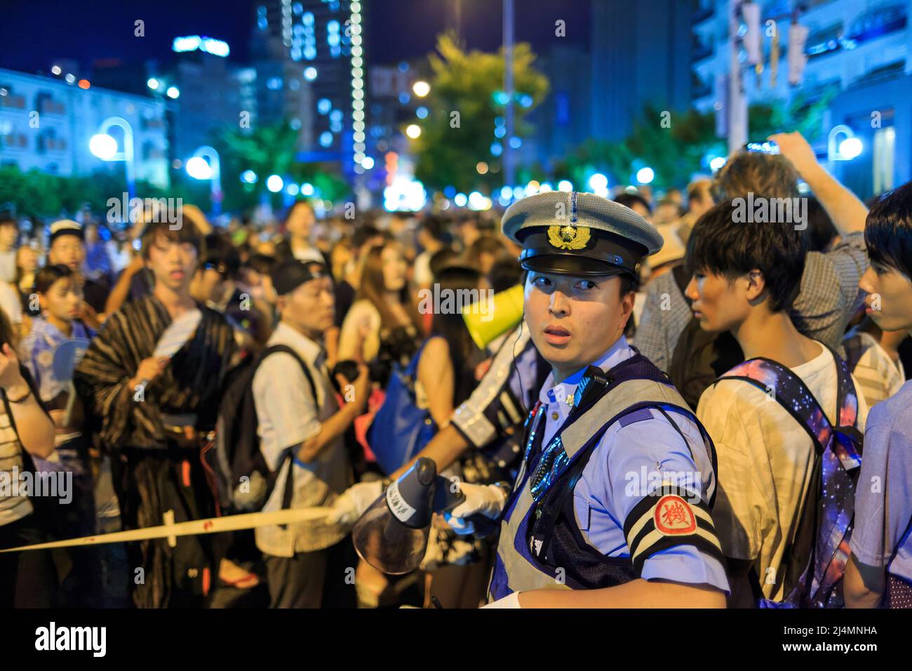 Police officer directs crowd hi-res stock photography and images - Alamy