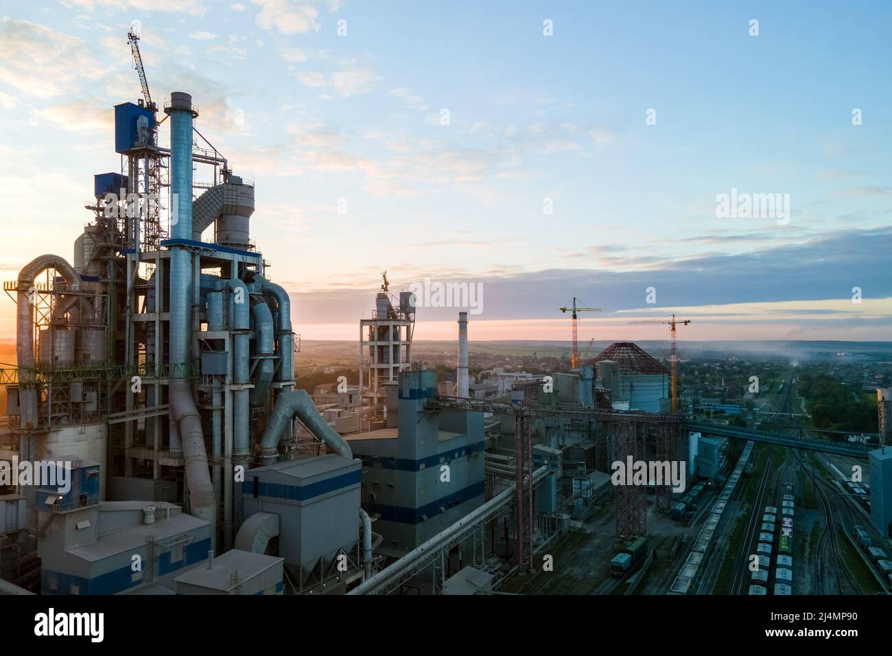 Aerial view of cement factory tower with high concrete plant structure ...