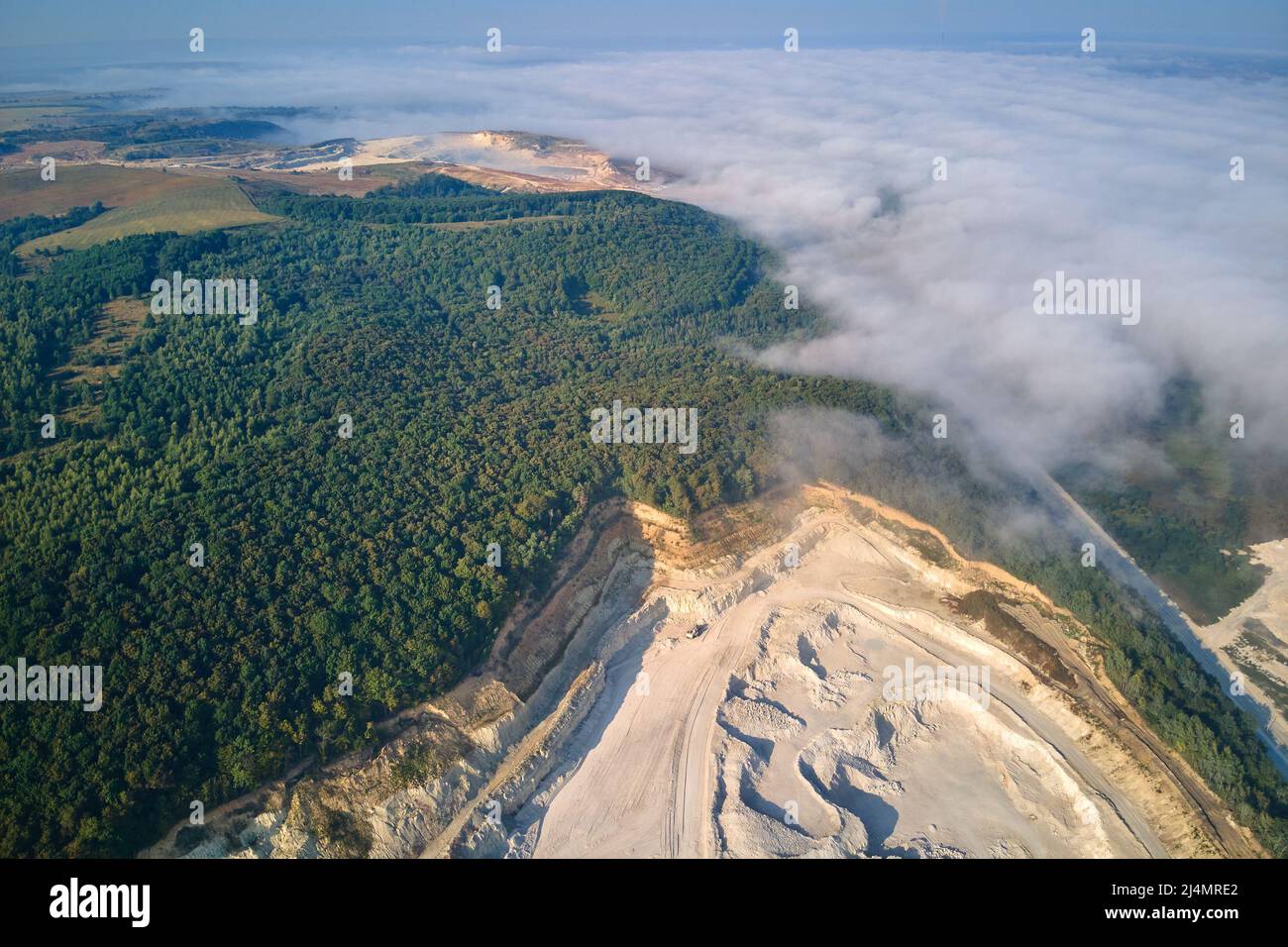 Aerial view of open pit mining of limestone materials for construction ...