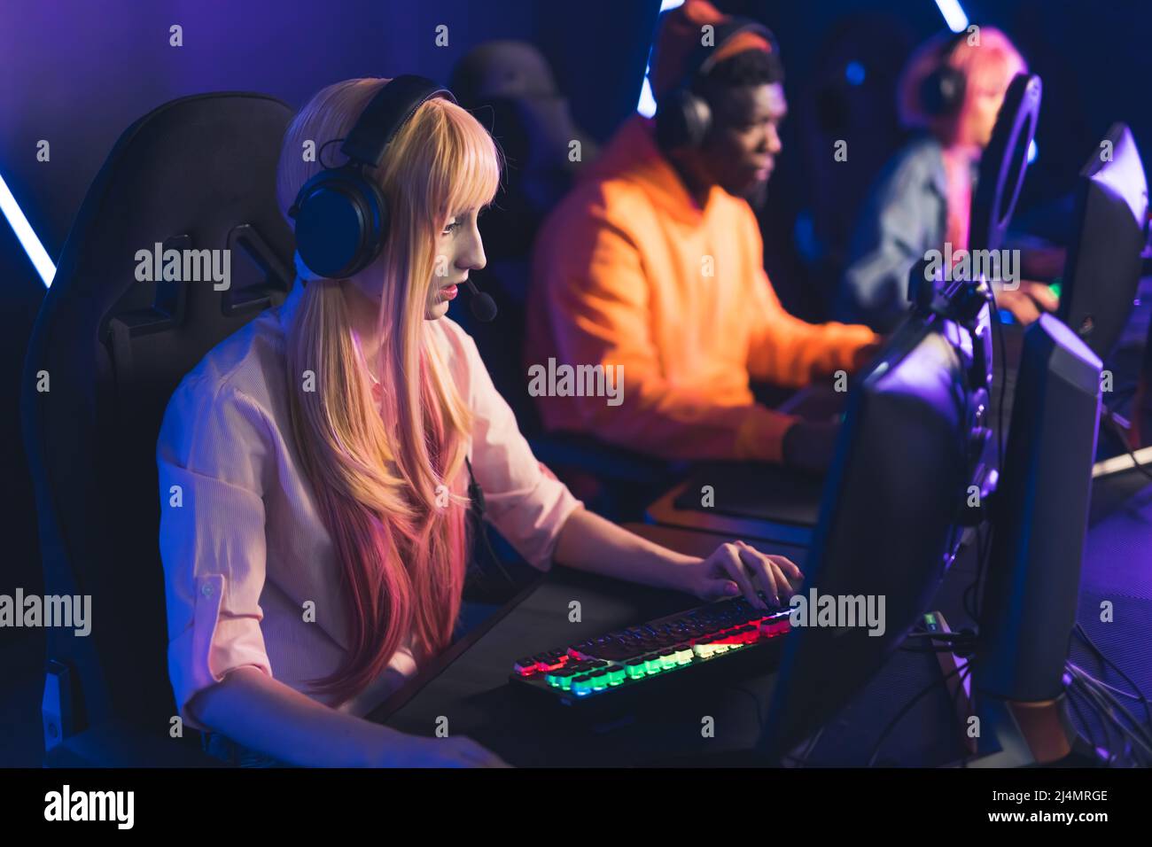 group of professional gamers playing in online video games tournament ...