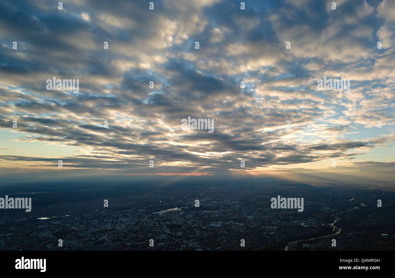 Aerial view from airplane window at high altitude of distant city ...