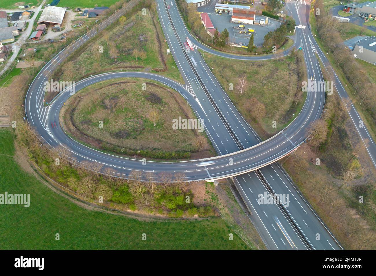 Aerial view of highway road intersection with fast moving heavy traffic ...