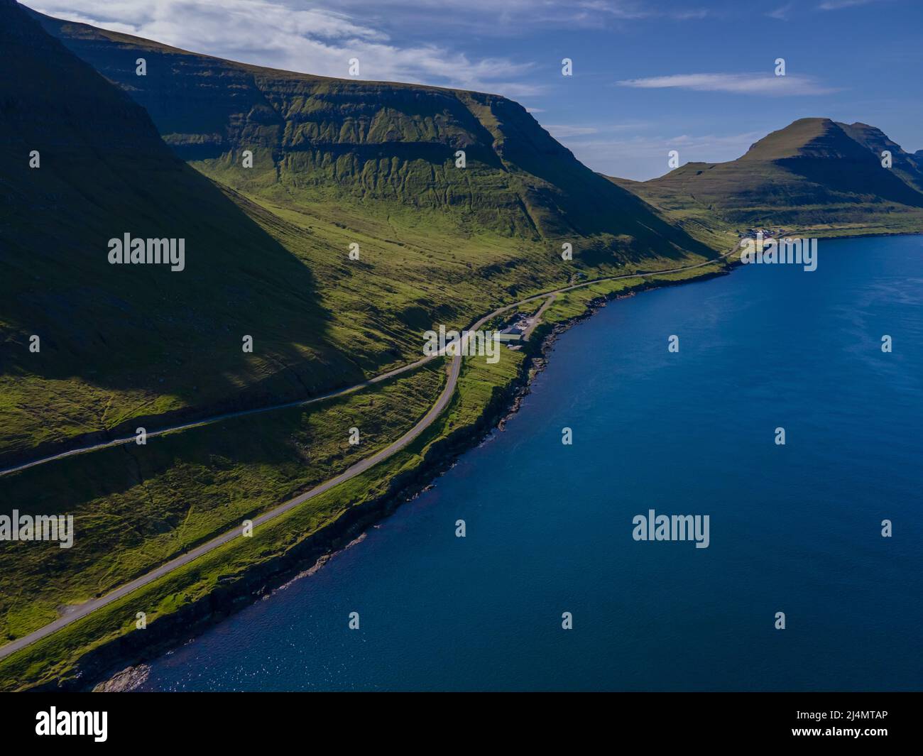 Beautiful aerial view of the Kallur Lighthouse in the Faroe Islands ...