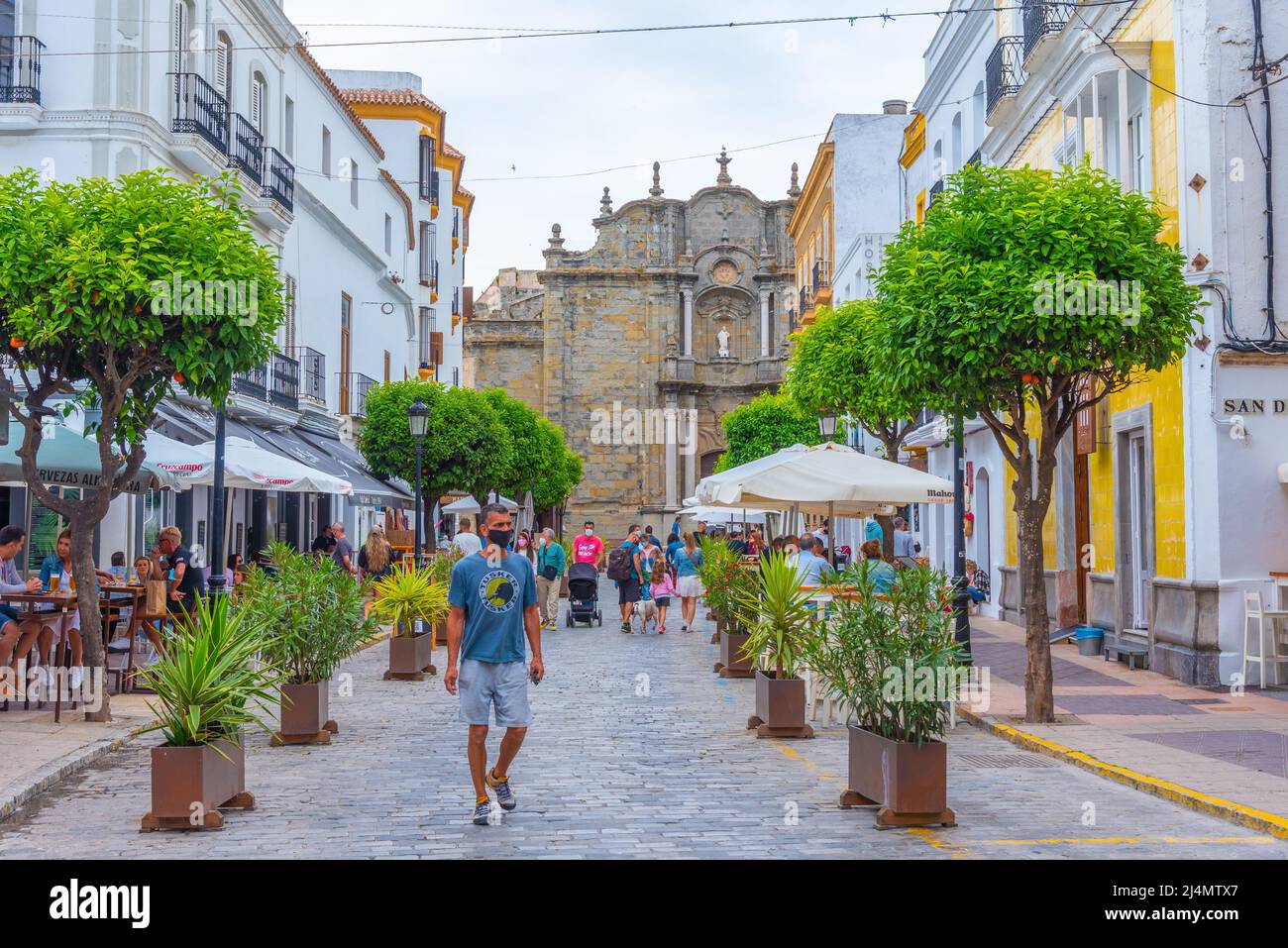 Tarifa, Spain, May 23, 2021: White street leading to the church of San ...