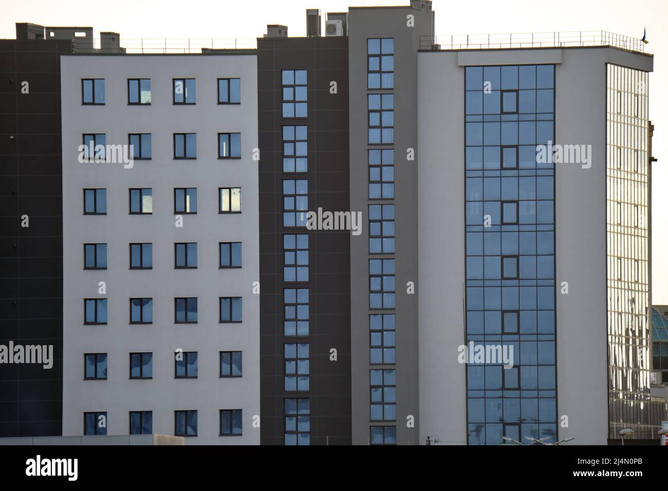 Architectural details of modern high apartment building facade with ...