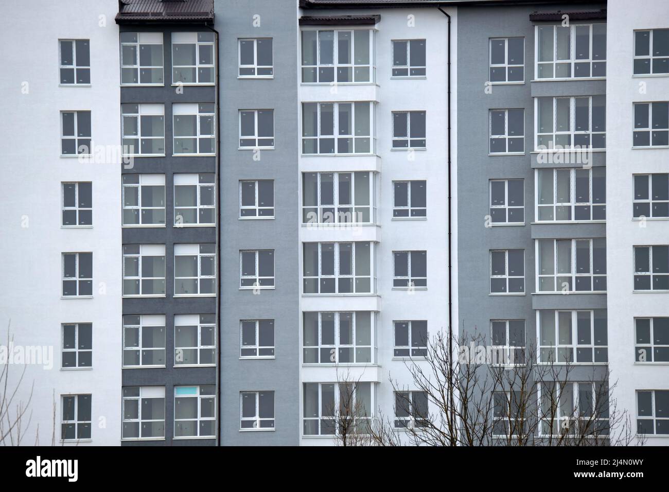 Architectural details of modern high apartment building facade with ...