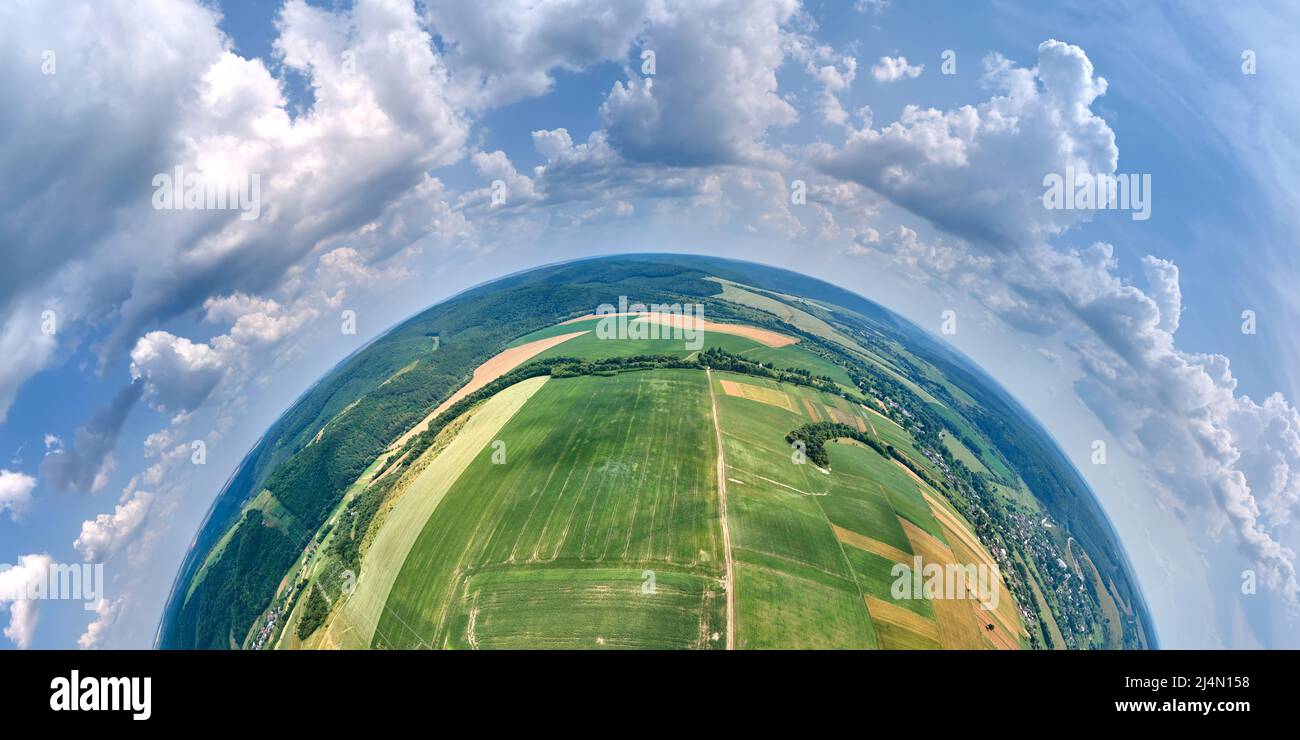 Aerial view from high altitude of little planet earth with green and ...
