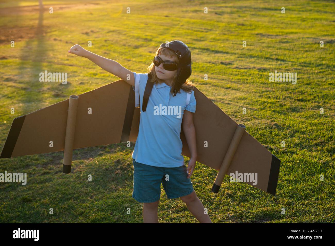Kid traveller with backpack wings. Child playing pilot aviator and ...