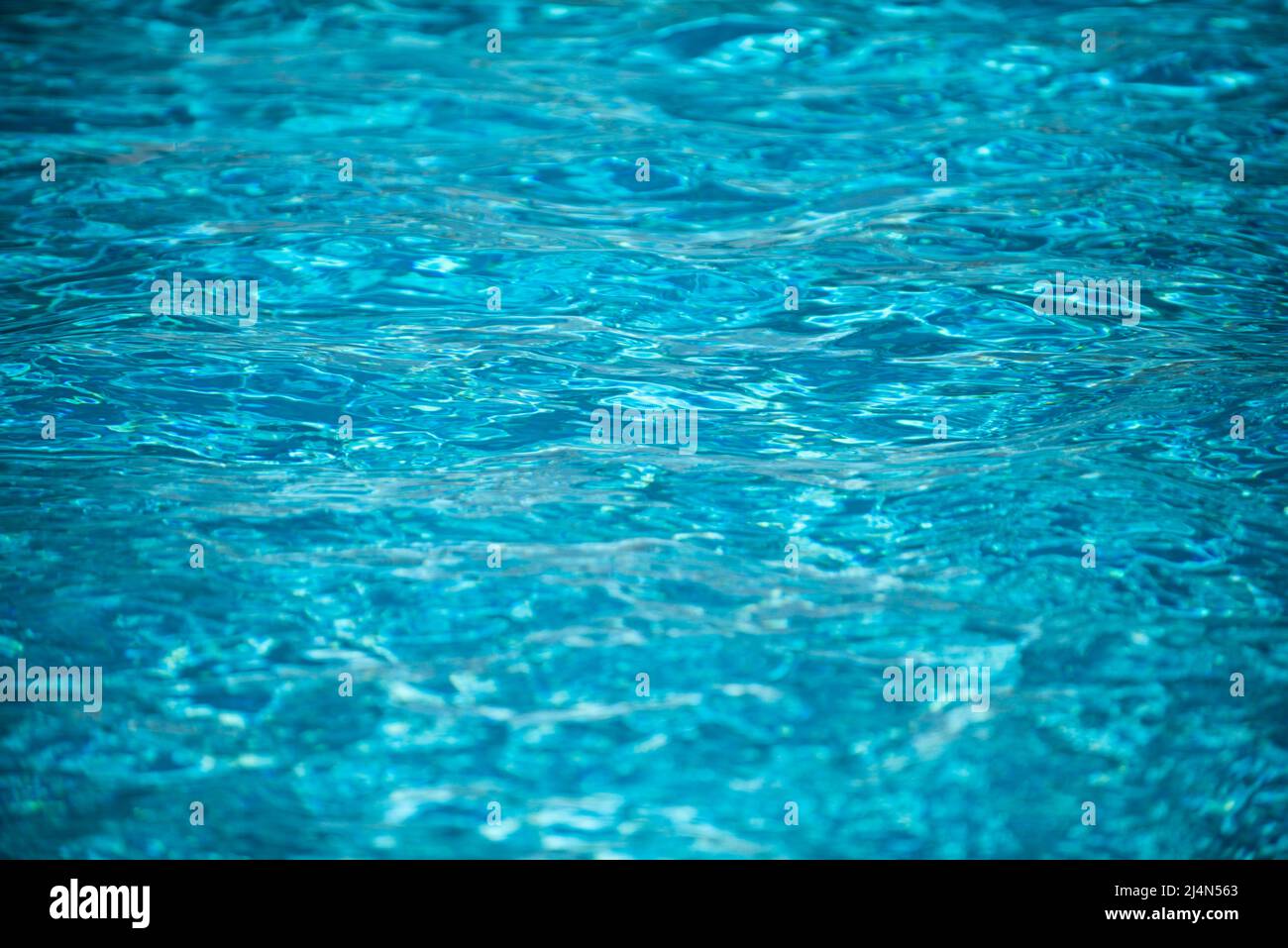 Abstract ripple wave and clear turquoise water surface in swimming pool ...