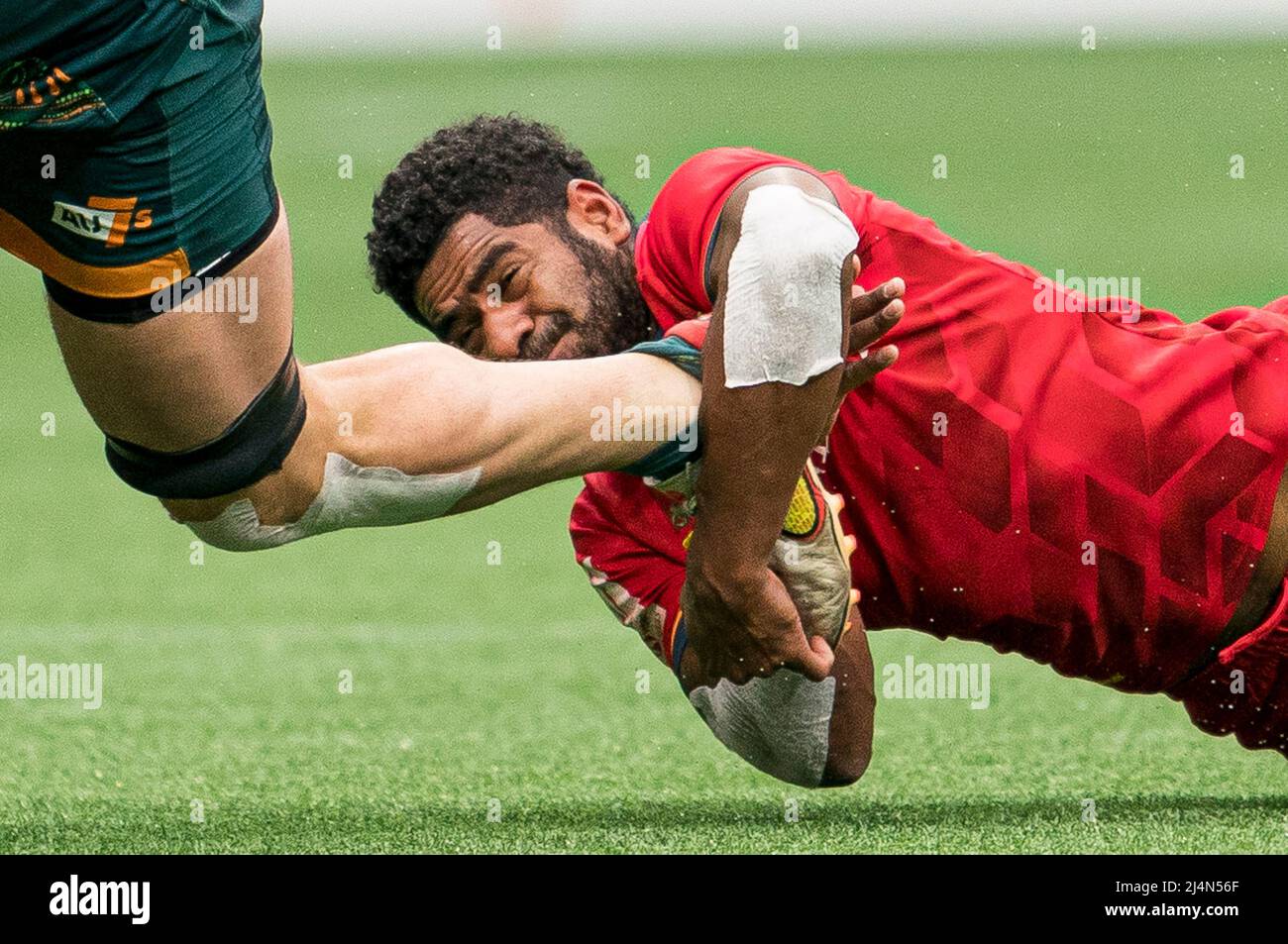 Spain's Jerry Davoibaravi grabs the foot of Australia's Michael Icely ...