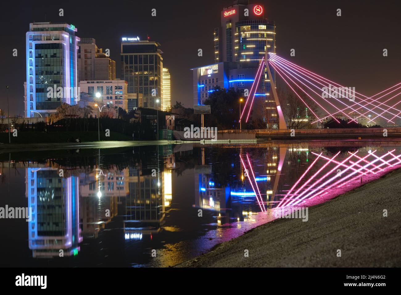 Beautiful city lights at night. Reflection of skyscrapers at rivers ...