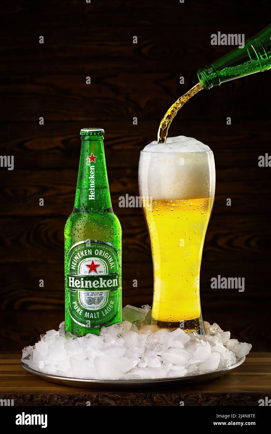 Tallinn, Estonia, March 2022. Heineken Lager Beer bottle with glass ...