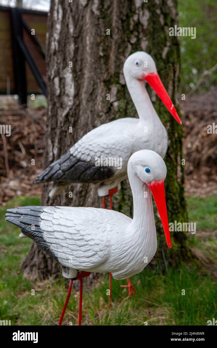 Artificial stork in the garden. Plastic bird decoration Stock Photo - Alamy