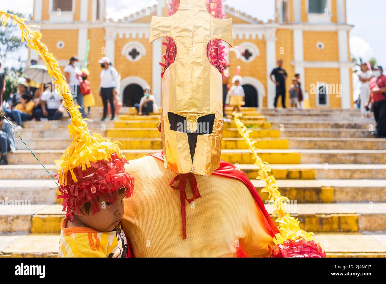 Unrecognizable masked man dressed as a Roman soldier outside a church ...