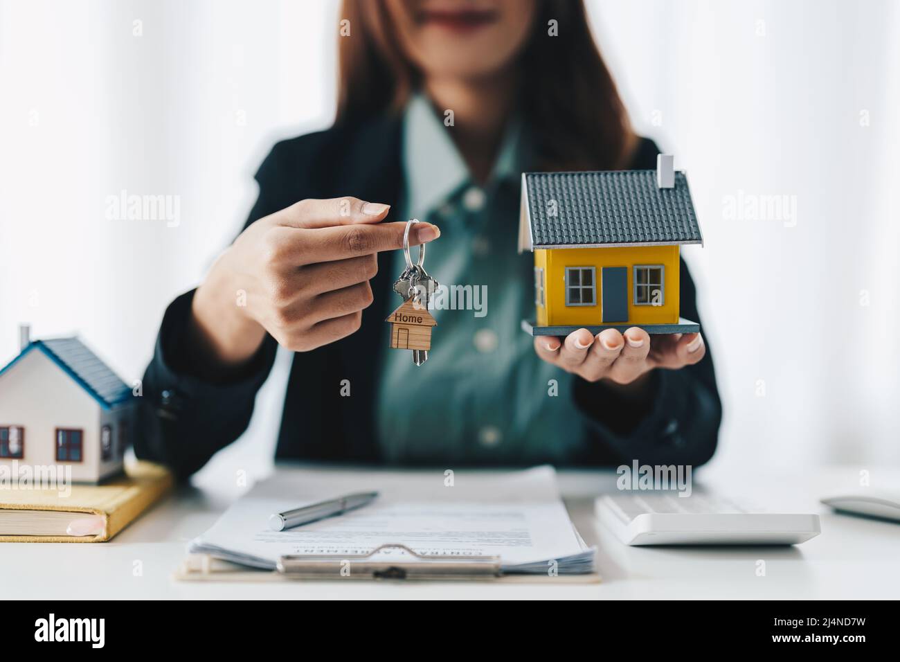 Asian Real Estate Agent Holding House Key To His Client After Signing Contractconcept For Real