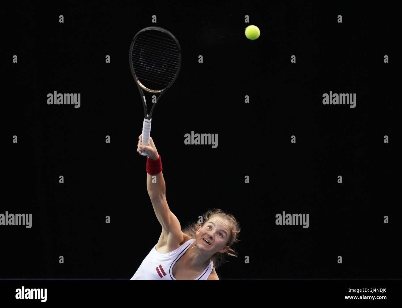 Vancouver, Canada. 16th Apr 2022. Latvia's Daniela Vismane serves to ...