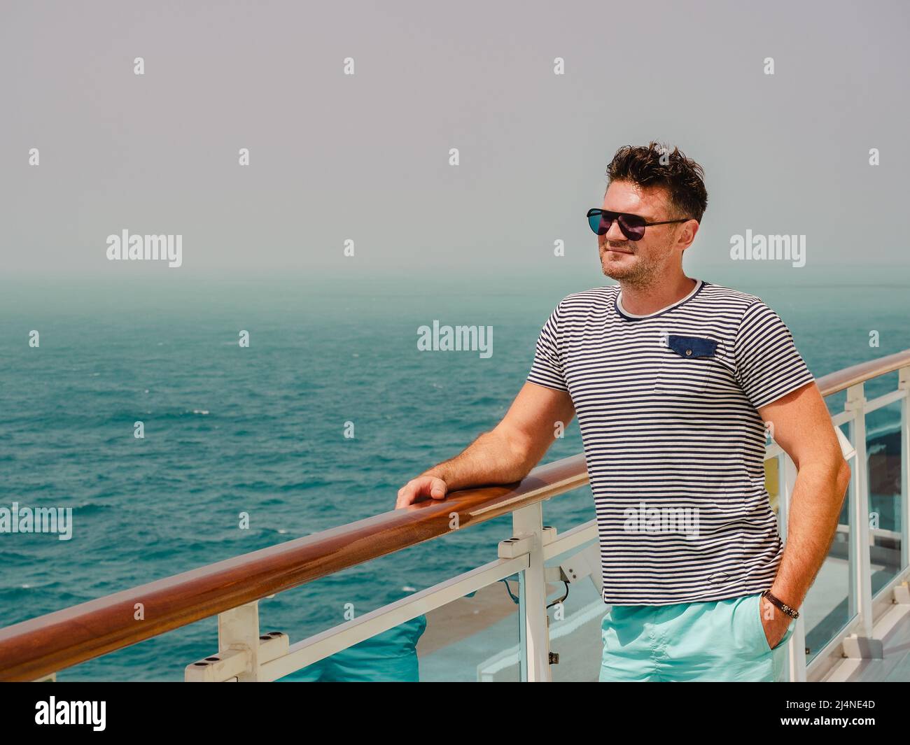 Back of man standing on deck of ship hi-res stock photography and ...