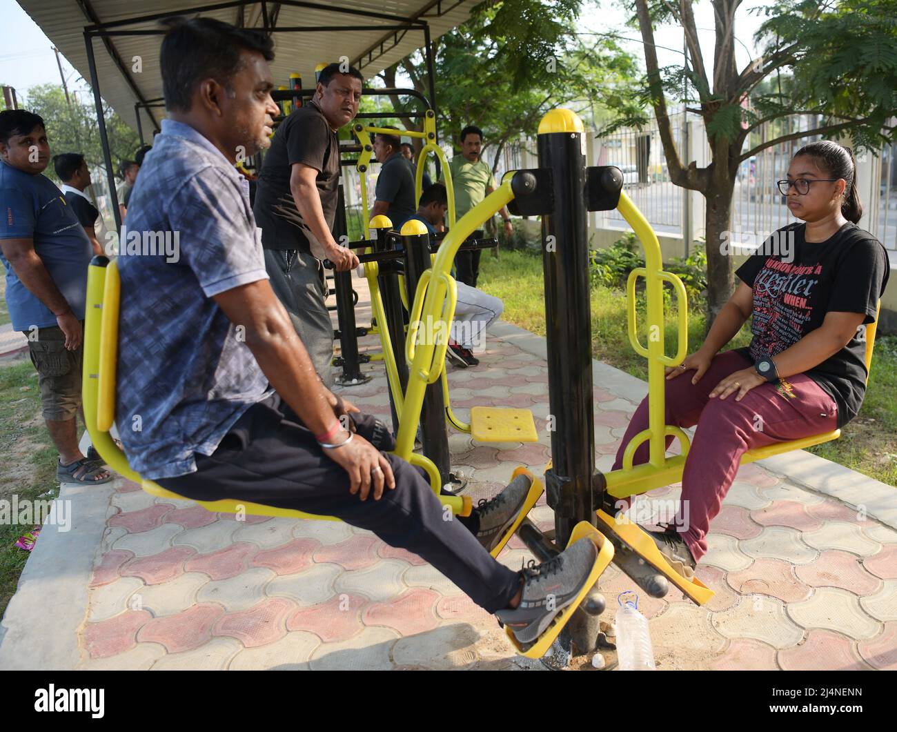 People are doing different exercises in an open gym on World Health Day ...