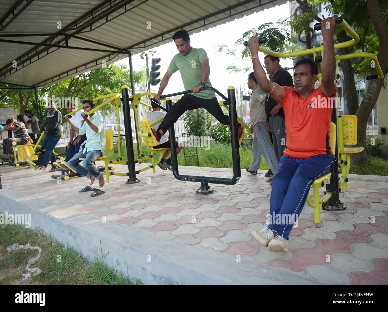 People are doing different exercises in an open gym on World Health Day ...