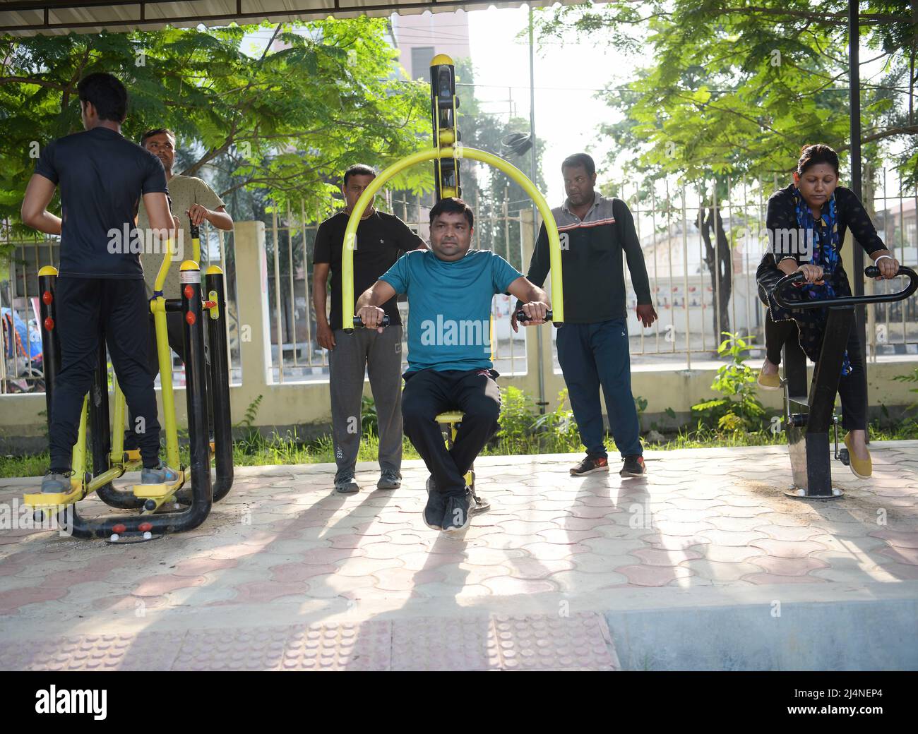 People are doing different exercises in an open gym on World Health Day ...