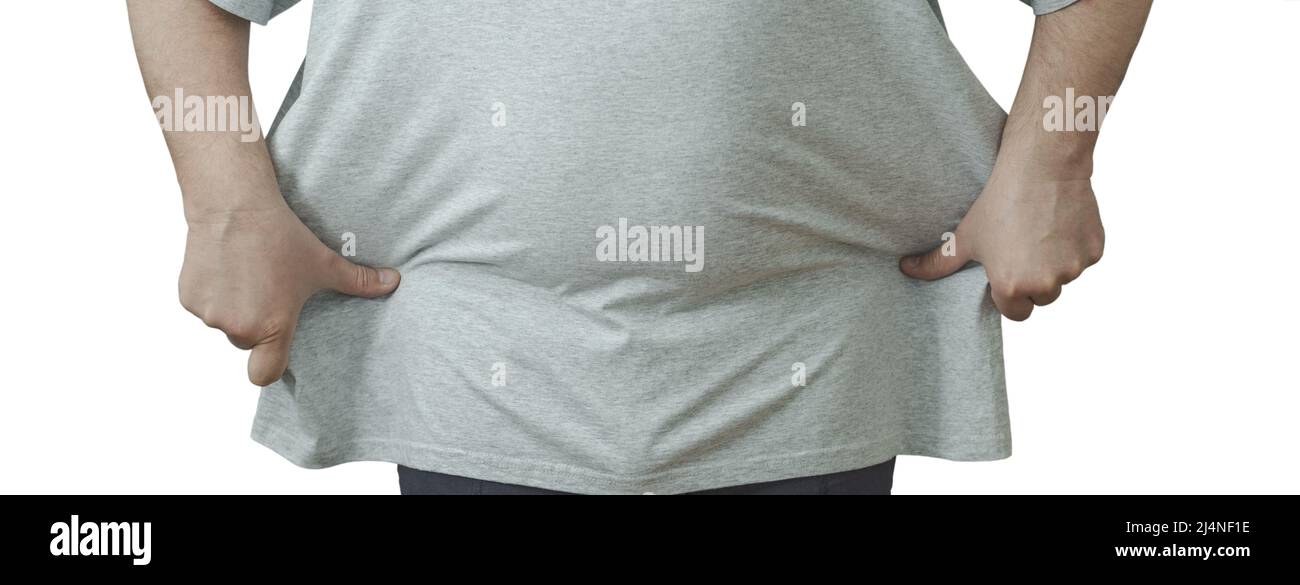 A fat man pulls a tank top on his stomach, the concept of losing weight ...