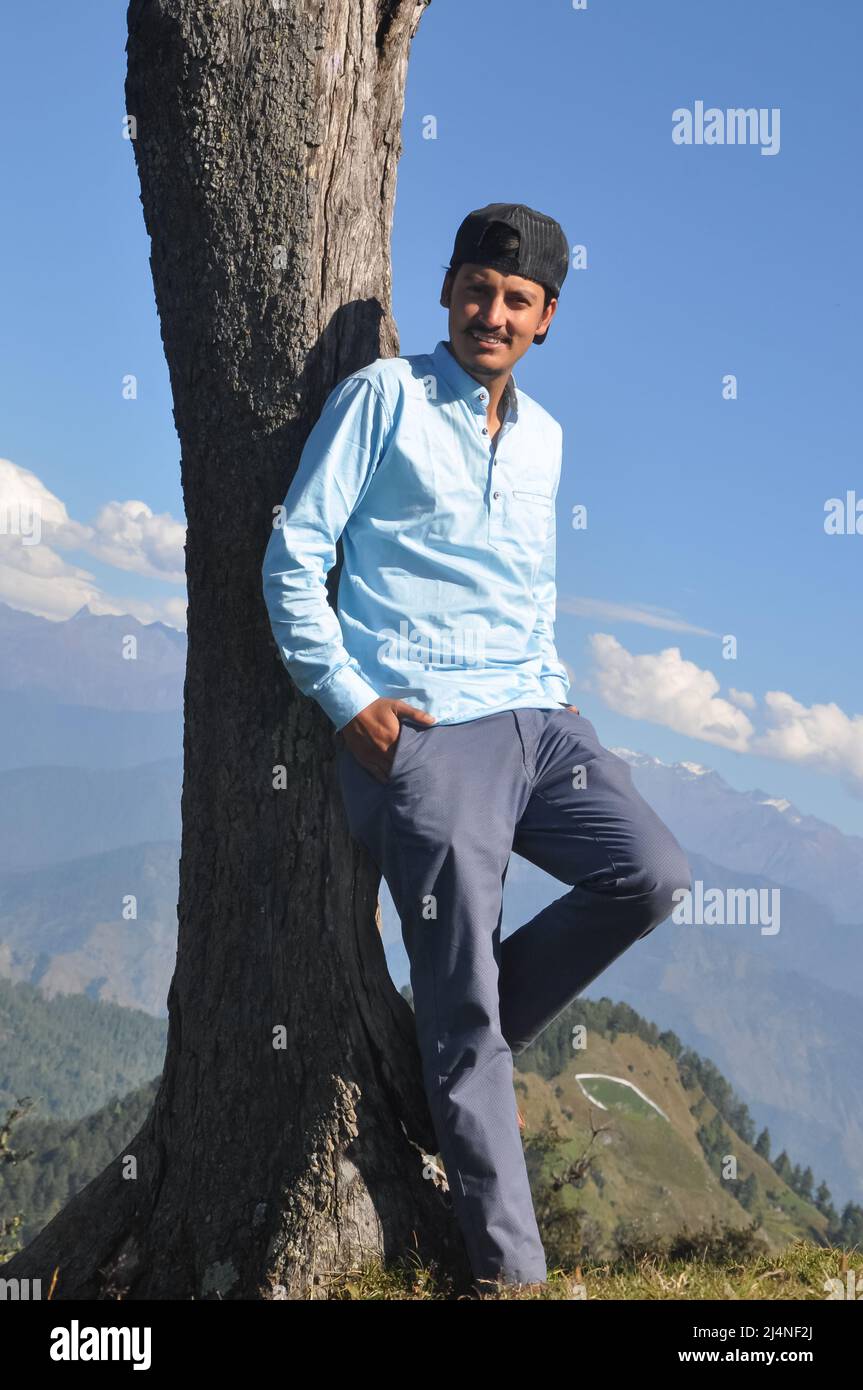 Person Leaning Against A Tree