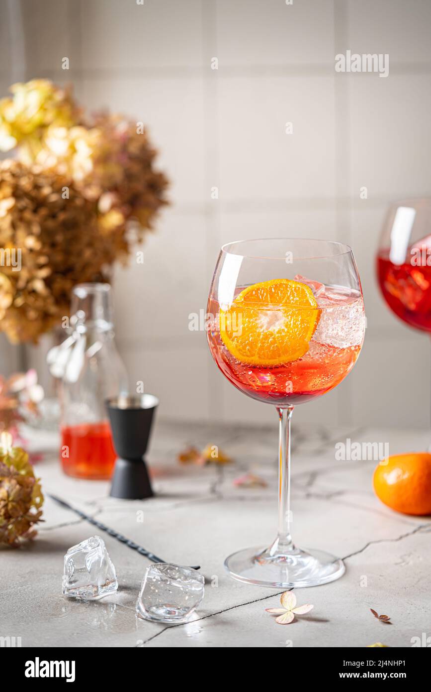 Italian Aperol Spritz cocktail with orange slices on gray stone table ...