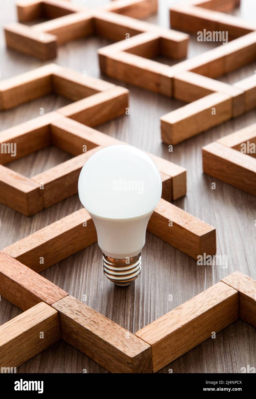 Light bulb in the maze game built by wood blocks, finding the right way ...