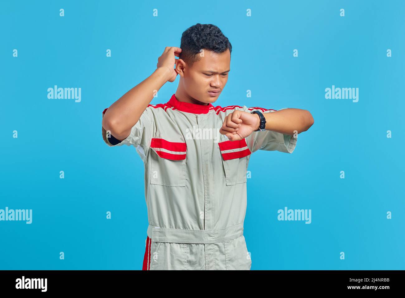 Portrait of young Asian mechanic worried about work deadline pressure ...