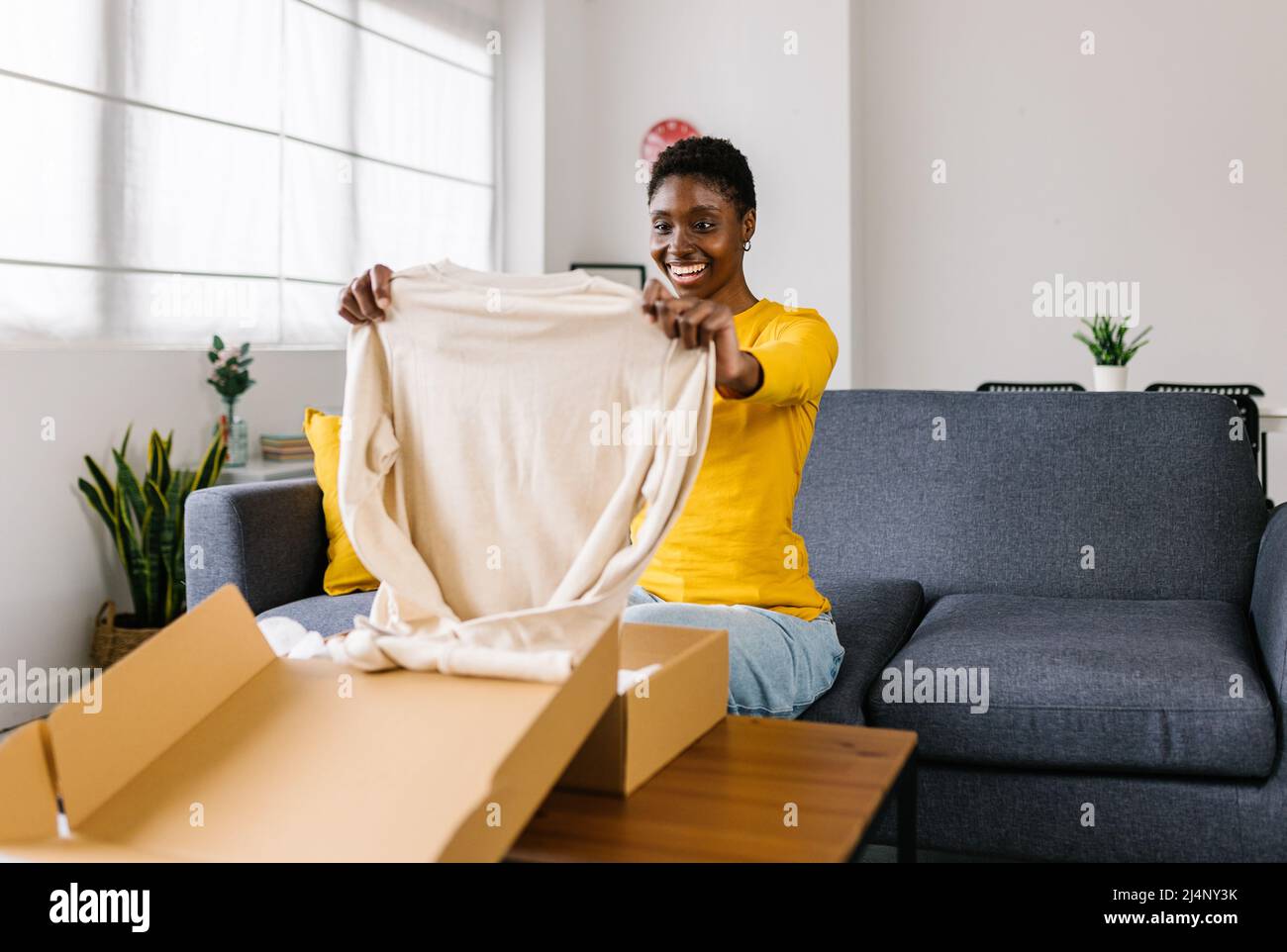 Unpacking the package hi-res stock photography and images - Alamy