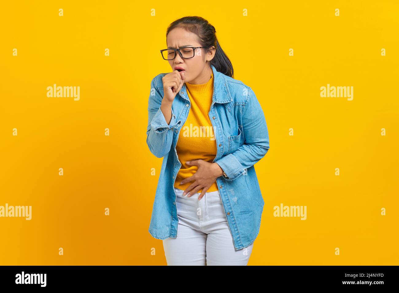 Beautiful young Asian woman student in denim clothes suffering with ...