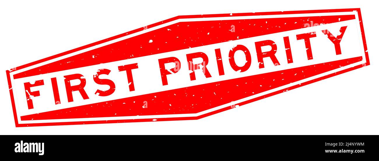 Grunge red first priority word hexagon rubber seal stamp on white ...