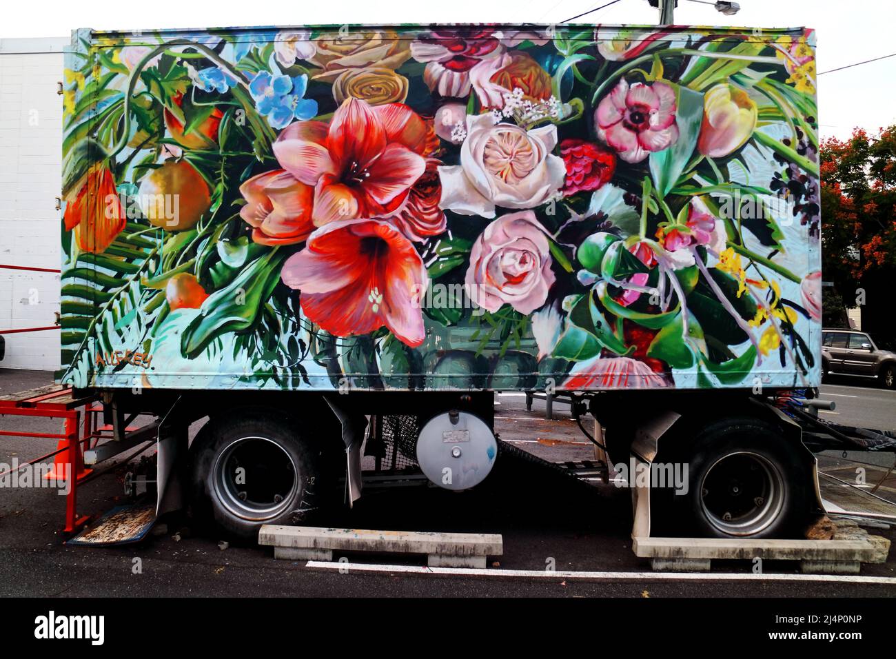 Vibrant street art mural painted on the side of a truck or trailer ...