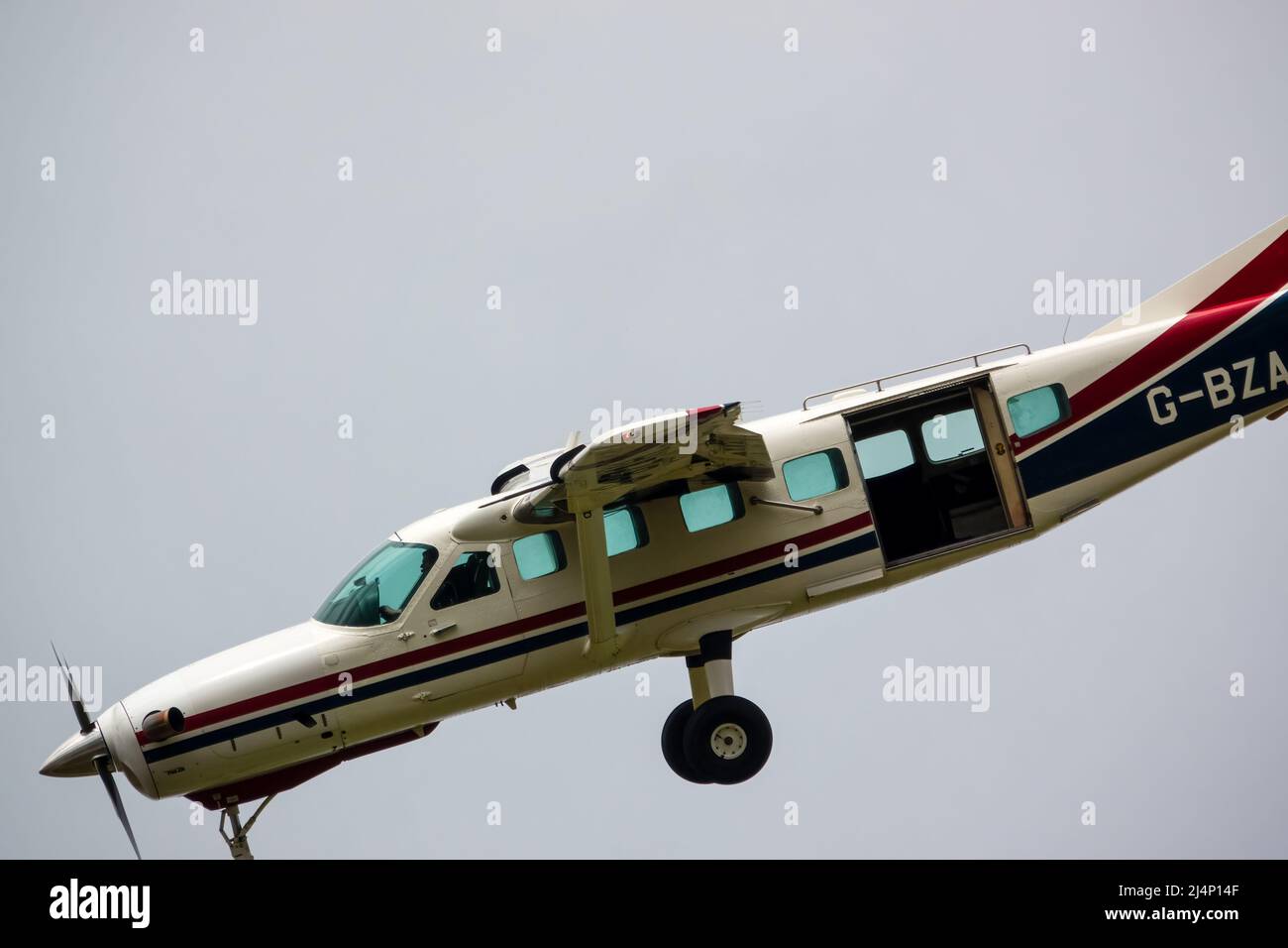 Cessna 208b Grand Caravan G-BZAH light aircraft descending to land ...