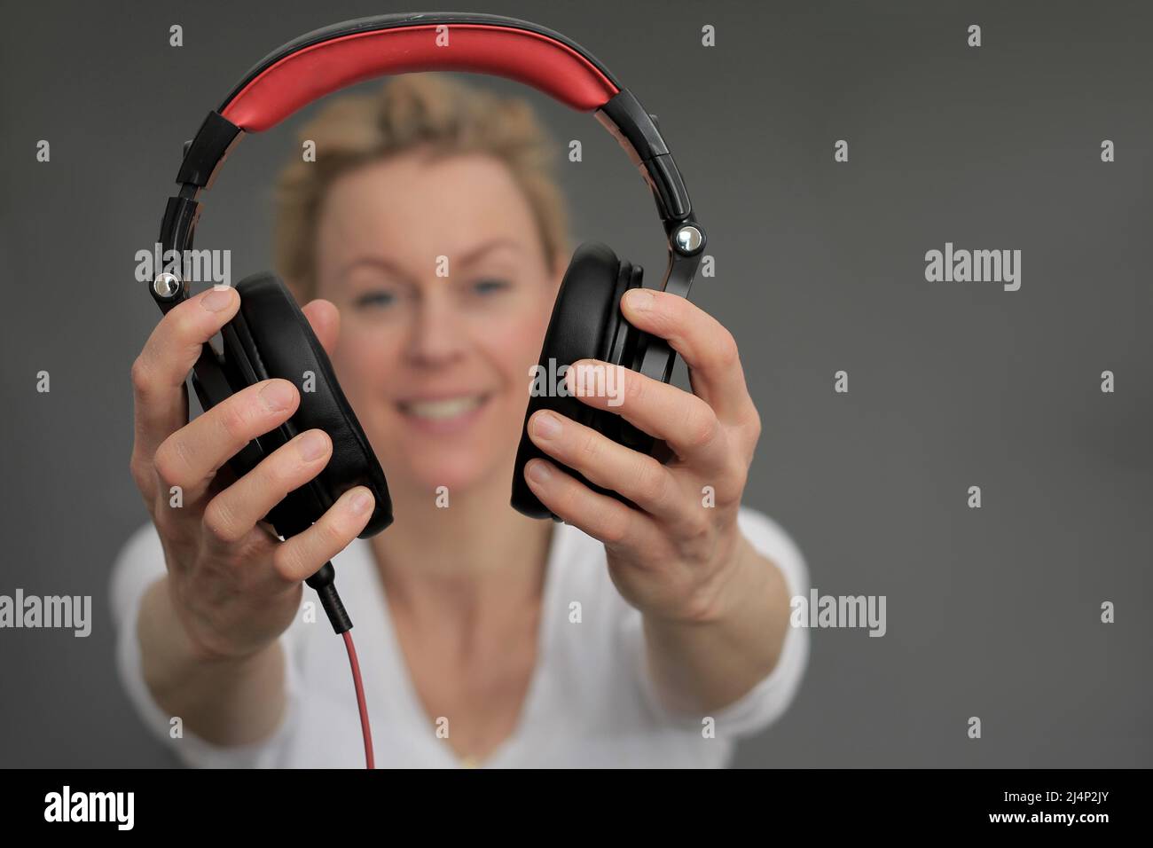 headphones listening to music with grey background with people stock ...